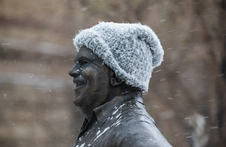 Statue-in-snow-with-winter-hat - College of Arts and Sciences