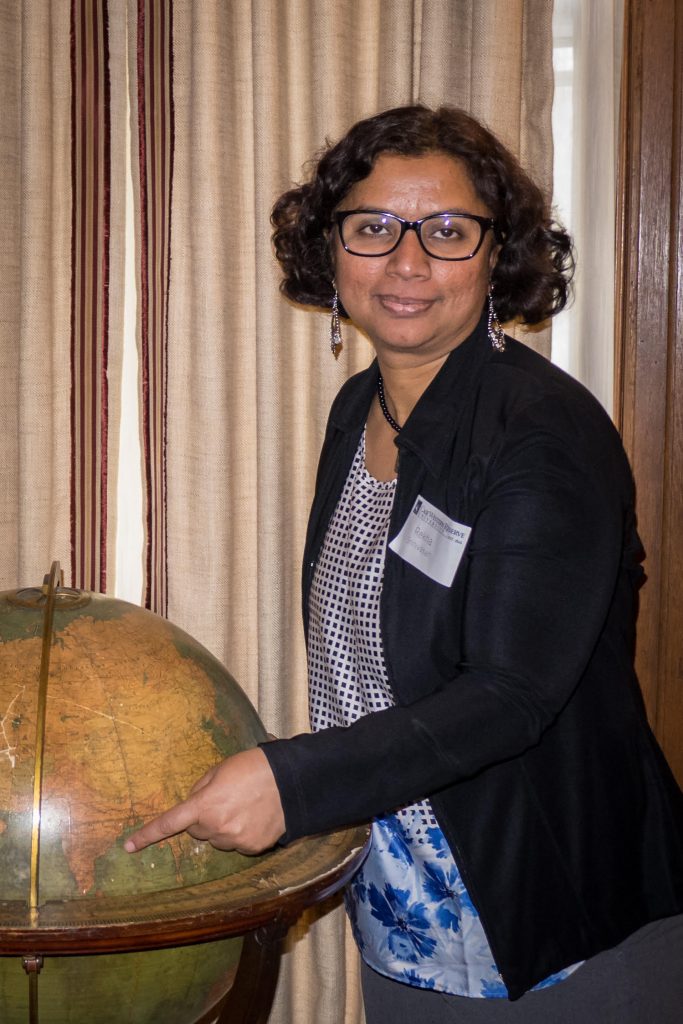 Rekha-with-globe - Department of Chemistry